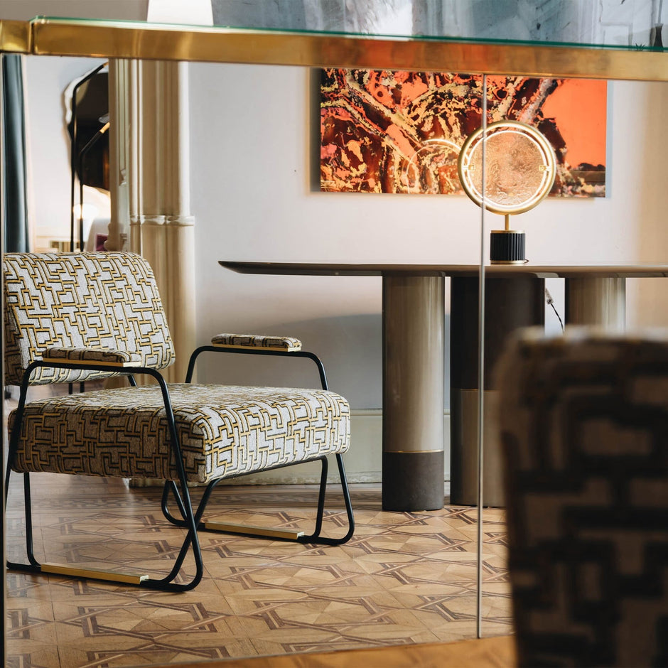 Apollo contemporary armchair, white fabric, black iron and brass