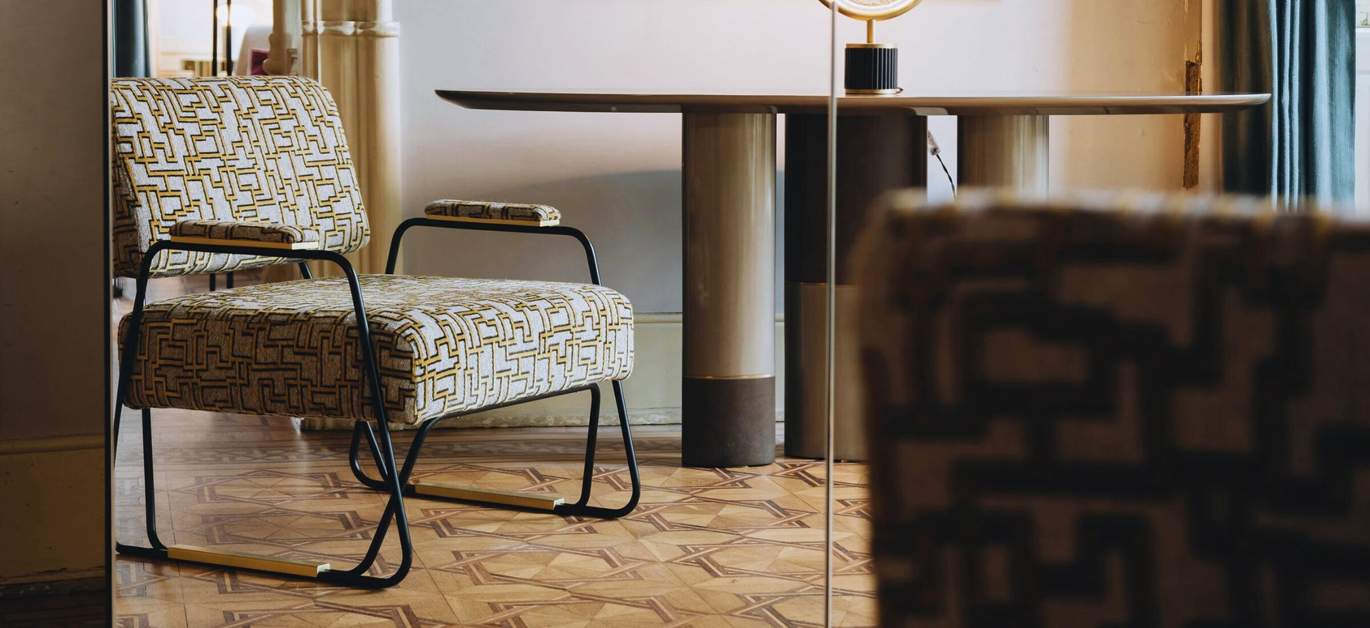 Apollo contemporary armchair, white fabric, black iron and brass